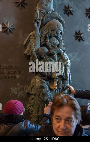 Pilgrims pass through the Holy Door of St. Peter's Basilica during the ...