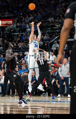 UCLA forward Tyler Bilodeau (34) is guarded by Rutgers center Lathan ...
