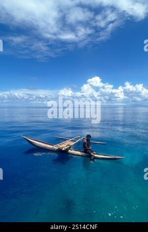 Resident of Vitu Islands in their traditional dugout canoes, Lama ...