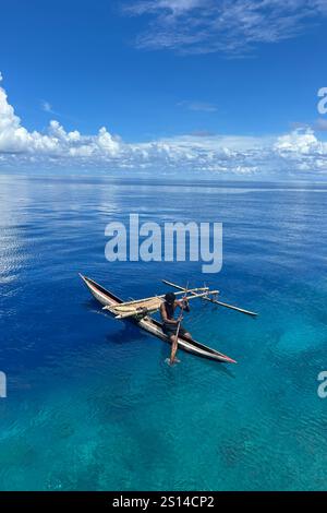Resident of Vitu Islands in their traditional dugout canoes, Lama ...