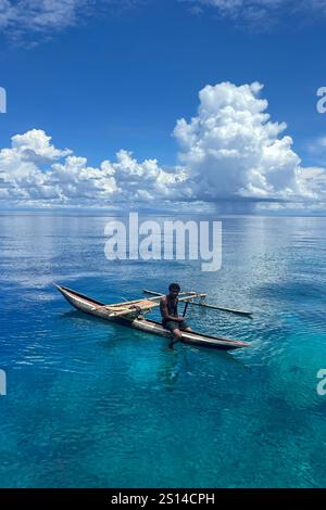 Resident of Vitu Islands in their traditional dugout canoes, Lama ...