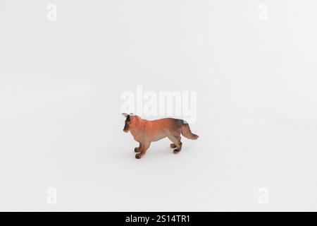 plastic wolf figurine toy on white background Stock Photo - Alamy