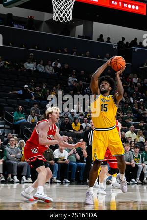 Utah guard Hunter Erickson (0) shoots over UCF forward Benny Williams ...