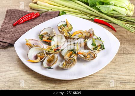 Delicous Asian mollusk shell steamed with spices Stock Photo - Alamy