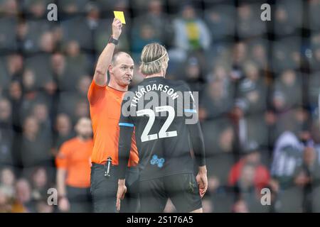 referee robert madley gives a yellow card to Kevin Keben of Watford ...