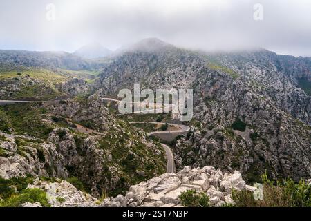 Winding road through rugged Sa Calobra Mountains. Famous tourist ...