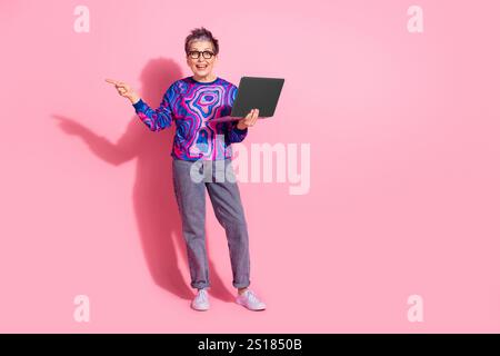 Photo of excited lady point netbook offer web discount wear white suit ...