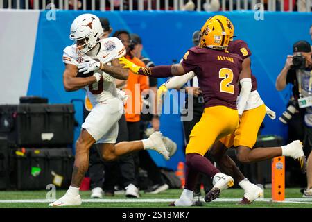 Texas wide receiver Deandre Moore Jr. (0) is tackled by Florida ...