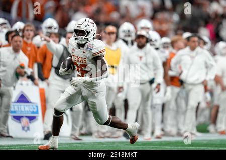 Texas running back Quintrevion Wisner (5) runs for a first down against ...