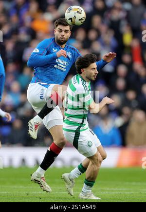 Celtic's Nicolas Kuhn (left) and Rangers' Jefte (right) battle for the ...