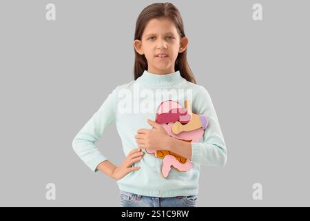 Teenage girl with appendicitis on light background Stock Photo - Alamy