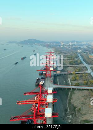 WUHU, CHINA - JANUARY 1, 2025 - Containers are loaded and unloaded at ...