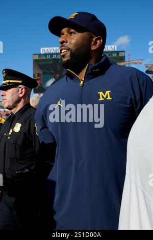 Michigan head coach Sherrone Moore leads his team onto the field before ...