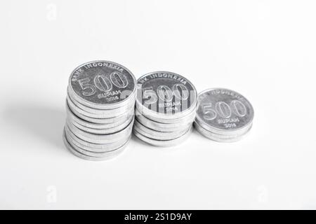 Stack of 500 rupiah coins on white background. National currency ...