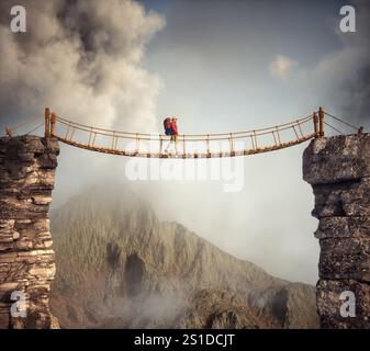 Hiker walking on a suspension bridge between mountains. THIS IS A 3D ...