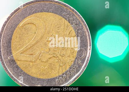 Face of 2 euro coin with blurred green bouquet in the background Stock ...
