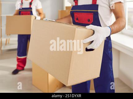 Male employee working in box delivery relocation service Stock Photo ...