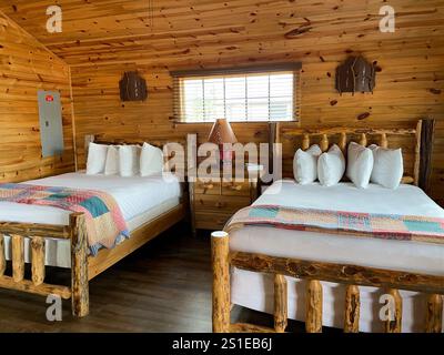 Interior of log cabin tourist accommodation in Badlands, South Dakota ...