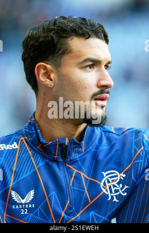 Jefte Vital da Silva Dias of Rangers FC competes for the ball with Alex ...