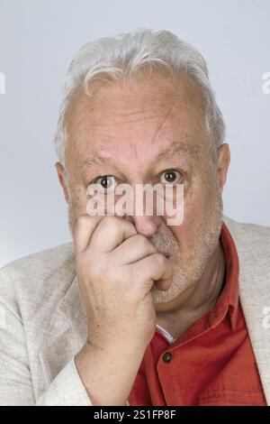 Senior in fear and panic on a light-coloured background Stock Photo - Alamy