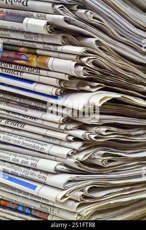Pile of newspapers lying down Stock Photo - Alamy