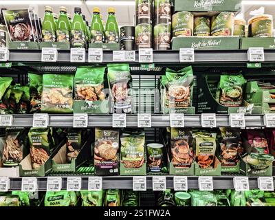 HUETTENBERG, HESSE, GERMANY 12 05 2022: Aisle with shelfes full of food ...