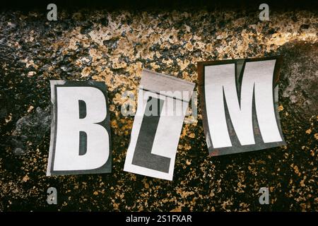 the Letters"BLM" using cut-out paper letters in the ransom note effect ...