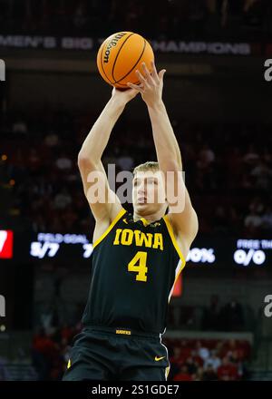 Iowa Hawkeyes guard Josh Dix (4) scores during a NCAA men’s basketball ...