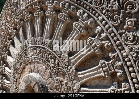 An ancient dharmachakra or wheel of dharma at Si Thep Historical Park ...