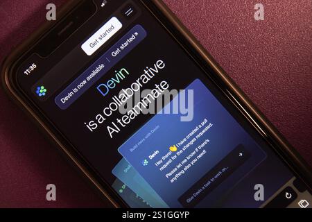 The website of Devin is displayed on an iPhone. Devin is a fully autonomous software engineering ...