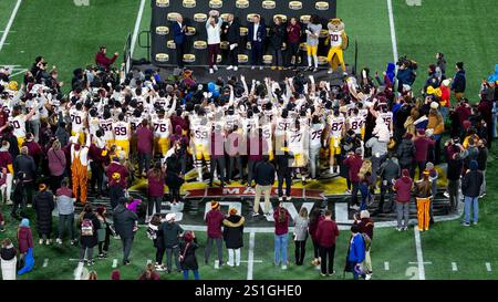 Minnesota head coach P.J. Fleck leads his team onto the field to play ...