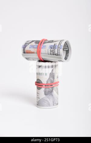 isolated US dollar banknotes roll on a white background with copy space ...