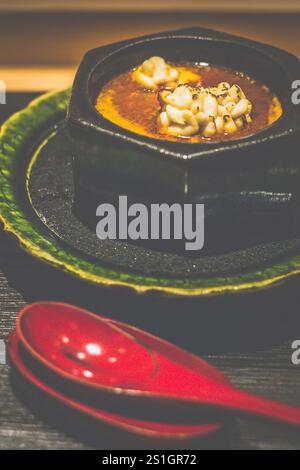 Cod Milt and Donabe Rice in japanese curry bisque soup Stock Photo - Alamy
