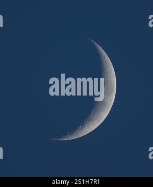 London, UK. 3rd Jan, 2024. The crescent Moon is passed by a Heathrow ...