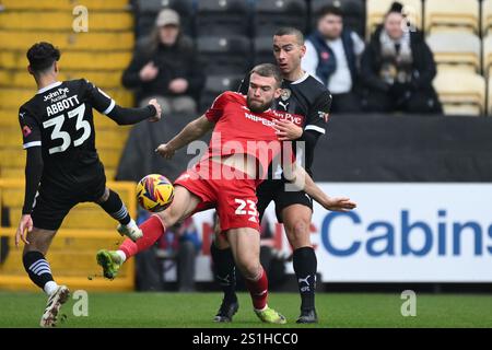 Rod McDonald of Notts County battles with Daniel Udoh of Salford City ...