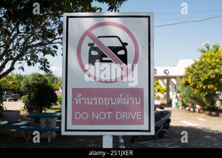 do not drive, warning sign in thai and english outside public offices ...