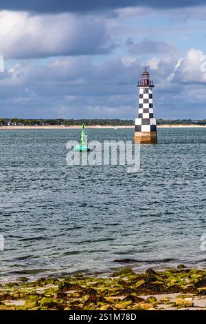 Checkerboard lighthouse of Ile Tudy in Brittany in France on a very ...