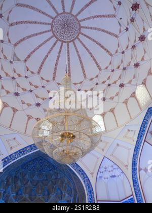 Close-up of a golden mosque dome with stainless steel spire naturally ...