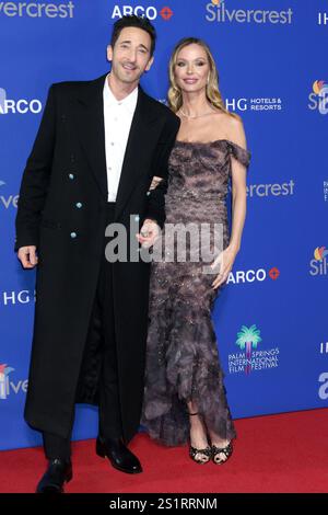 Adrien Brody, left, and Georgina Chapman arrive at the Oscars on Sunday ...