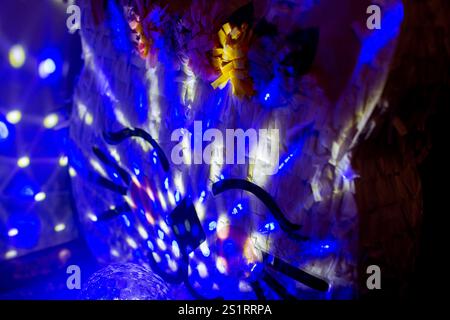 Cat Face Pinata Decoration Illuminated by Red Lights on Black ...