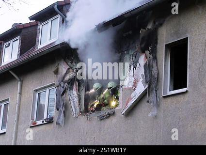Firefighters look at flames and smoke from the Palisades Fire as they ...