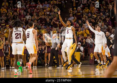 Arizona State guard Amier Ali drives on Houston guard Milos Uzan during ...