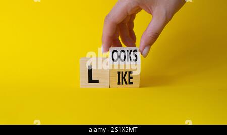 Looks like symbol. Concept words Looks like on wooden cubes. Beautiful ...