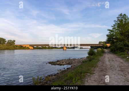 runs across the bridge in a green dress and hat in hand Stock Photo - Alamy