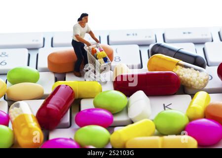 Many tablets and computer keyboard. Symbol photo for online and ...