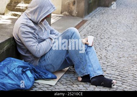 An unemployed beggar is homeless and hungry Austria Stock Photo - Alamy
