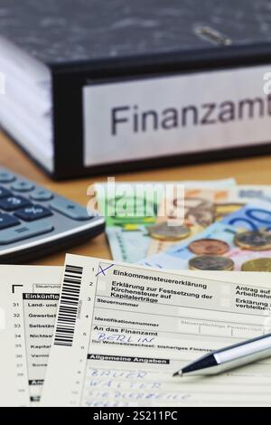 A German tax return for income tax is completed. Austria Stock Photo ...