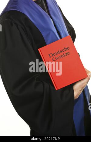 A judge with a German law book in court Austria Stock Photo - Alamy