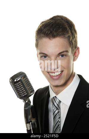 A young singer with a retro microphone sings karaoke Austria Stock ...