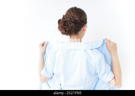 Nurse changing clothes Stock Photo - Alamy
